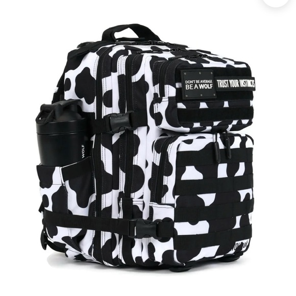 Wolfpack | Bags | Wolfpack Cow Print Backpack | Poshmark